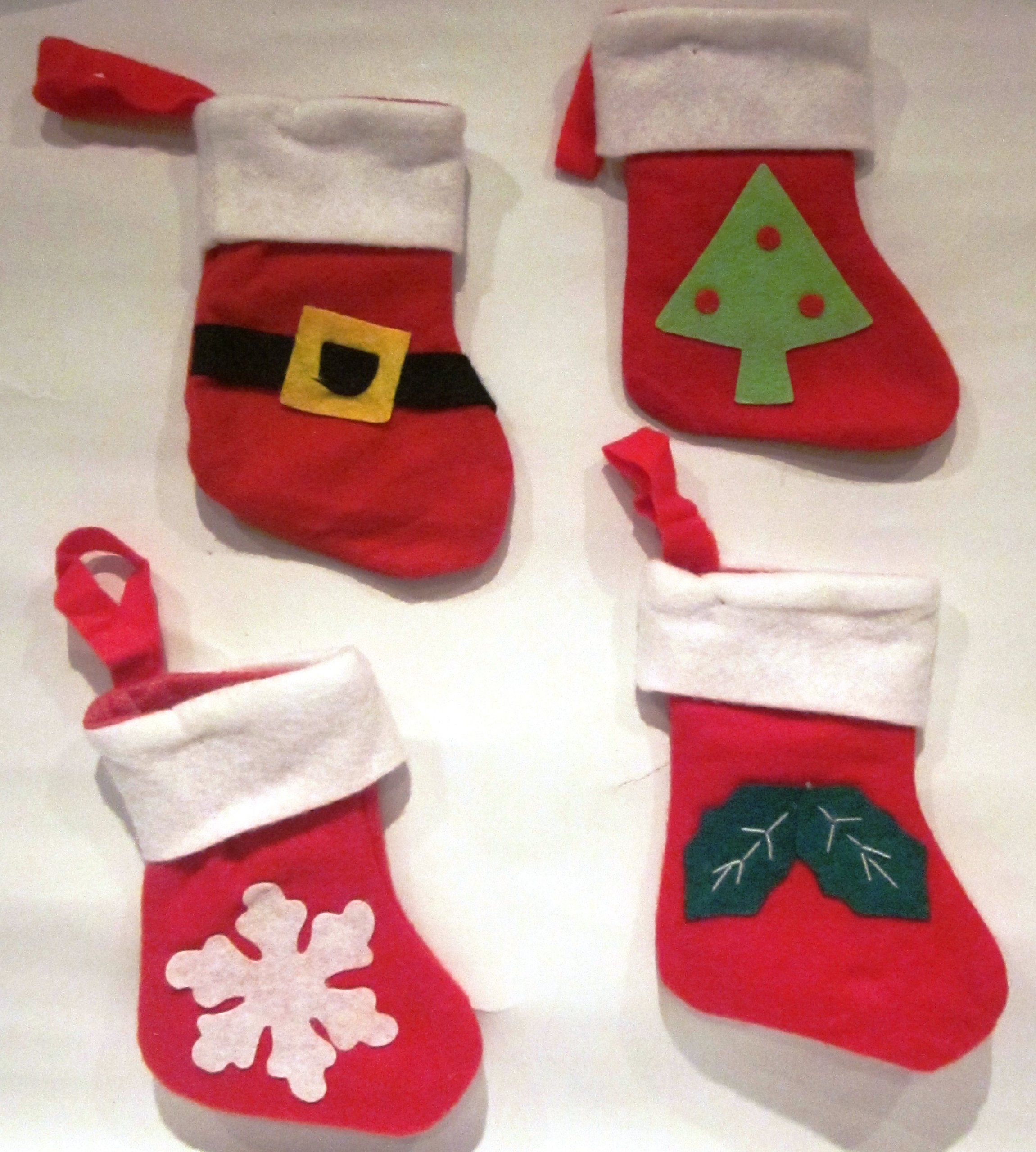 Set Of Four Baby Mini Christmas Stockings