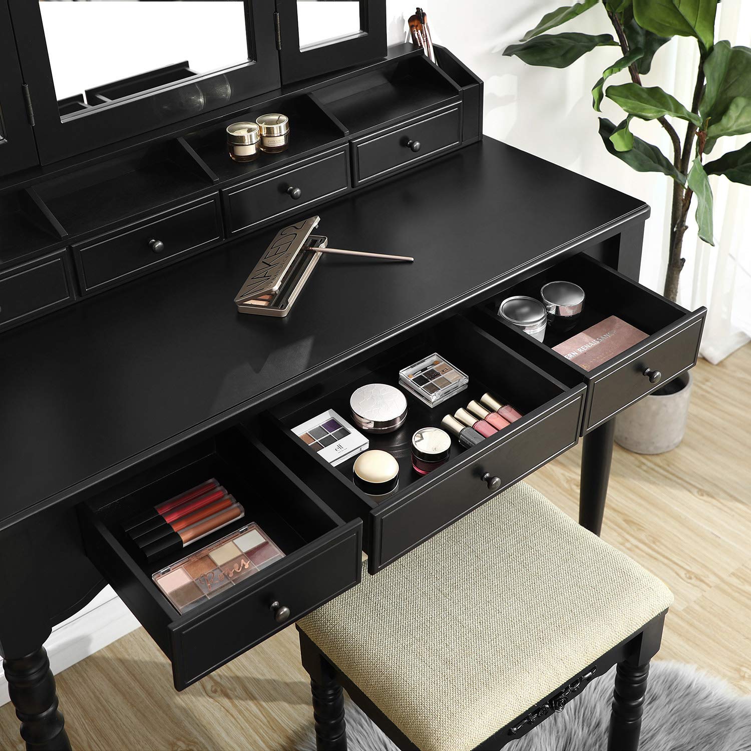 VASAGLE Vanity Makeup Set with 7 Drawers, 2 Brush Slots and 4 Open Compartments, Dressing Table with Tri-Fold Necklace Hooked Mirror, Solid Wood Legs, Cushioned Stool, Black URDT06BK